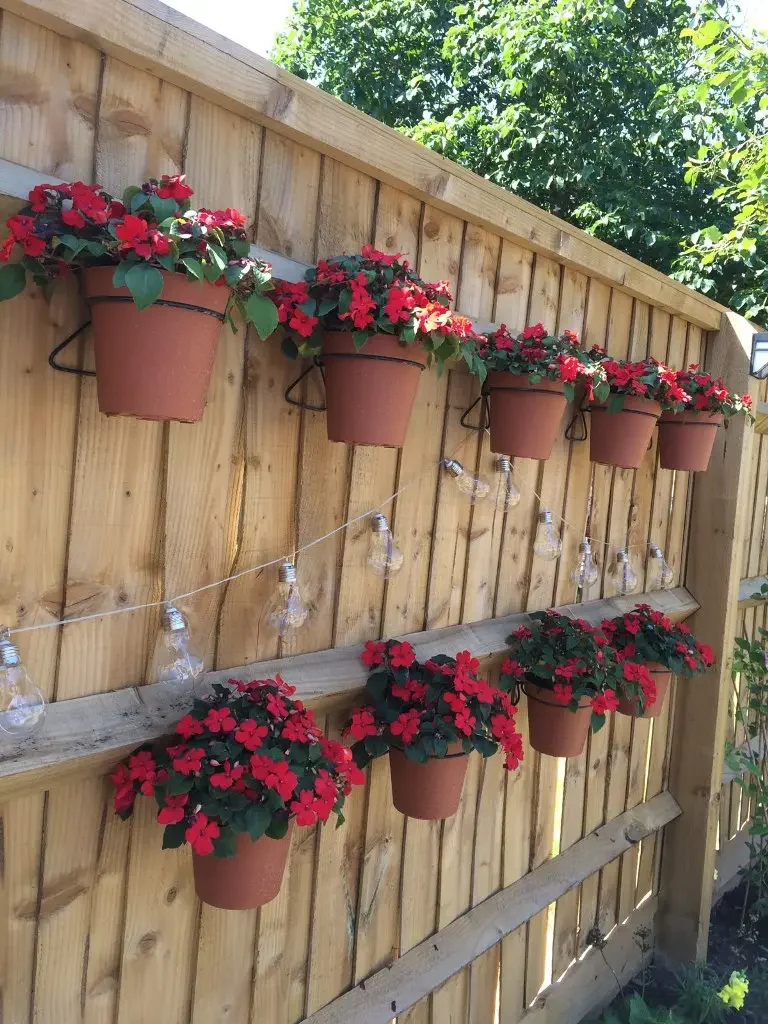 35 DIY Fence Planters That Will Maximize Your Growing Space