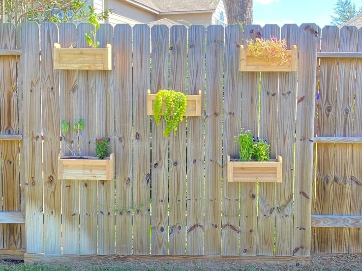 35 DIY Fence Planters That Will Maximize Your Growing Space
